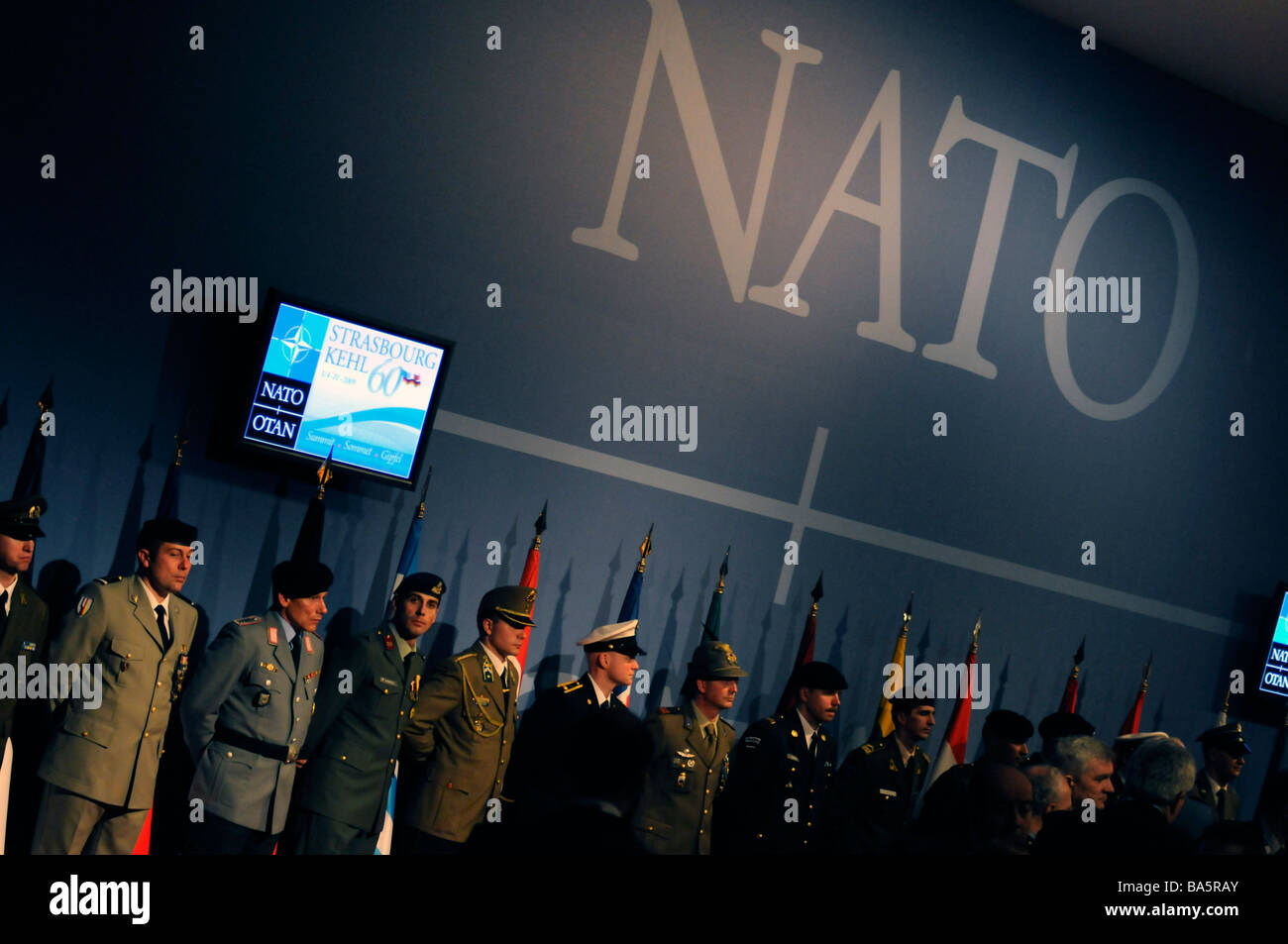 Military officers from the NATO countries standing in a room during the ...