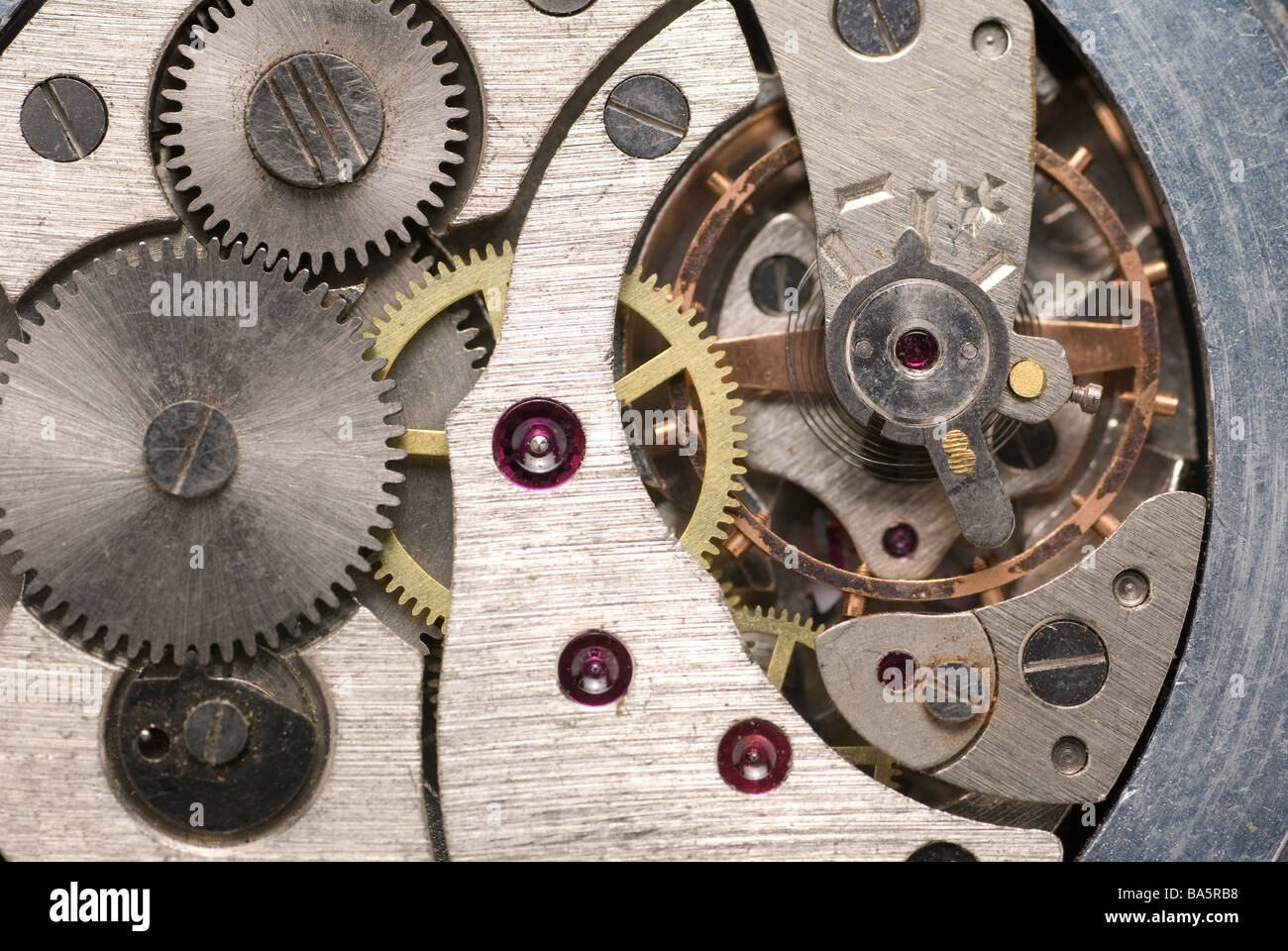 The mechanism of analog hours A photo close up Stock Photo - Alamy