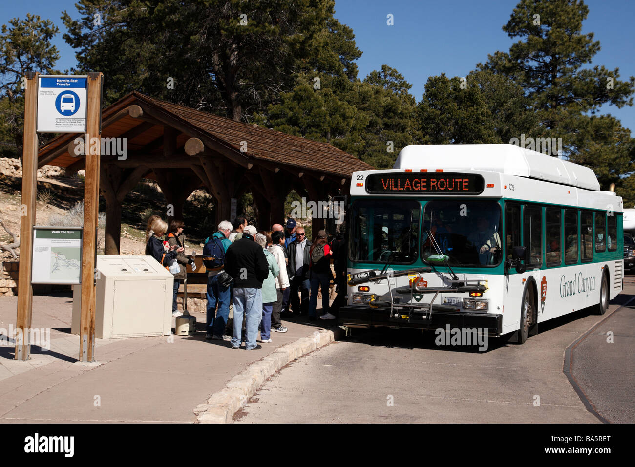tourists about to board the village route shuttle bus at the hermits ...