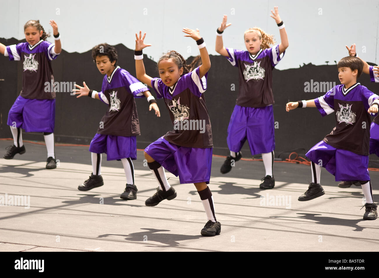 A group of young children performing a Hip-Hop routine at an event at ...