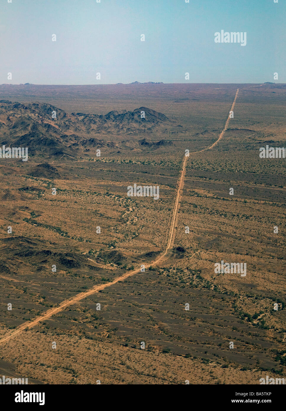 aerial view above desolate Arizona desert road over hills Stock Photo ...