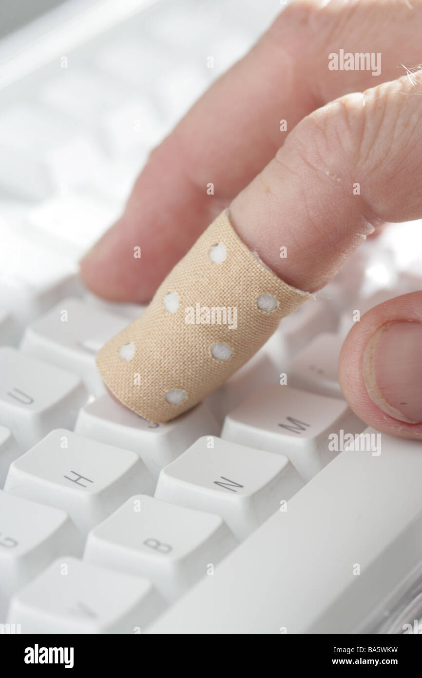 Men's-hand index fingers Band-Aid computer-keyboard data input detail ...