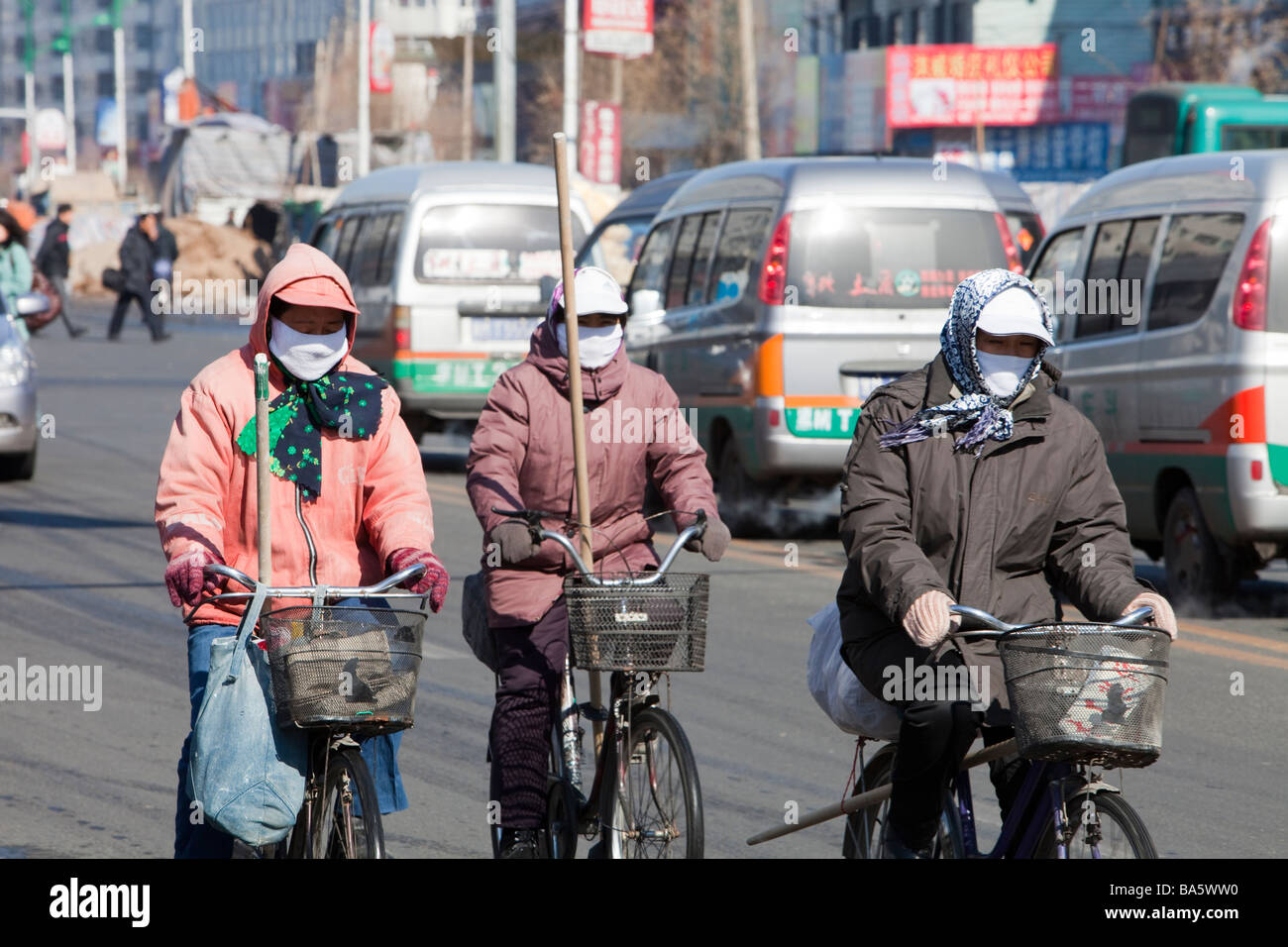 cyclists wearing smog masks against air pollution in Suihua in northern ...