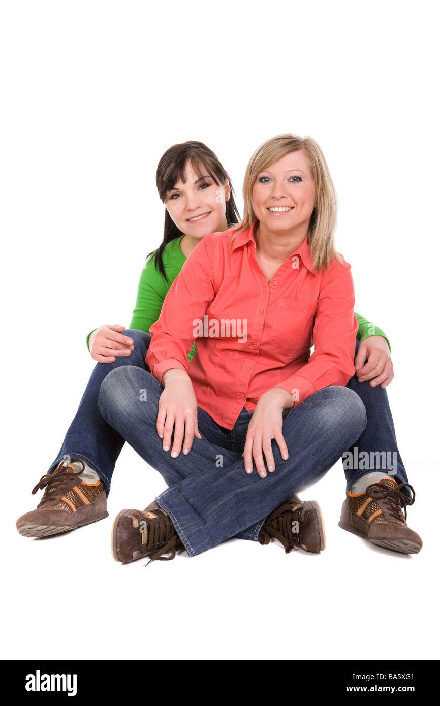 two crazy women in friendship over white background Stock Photo - Alamy