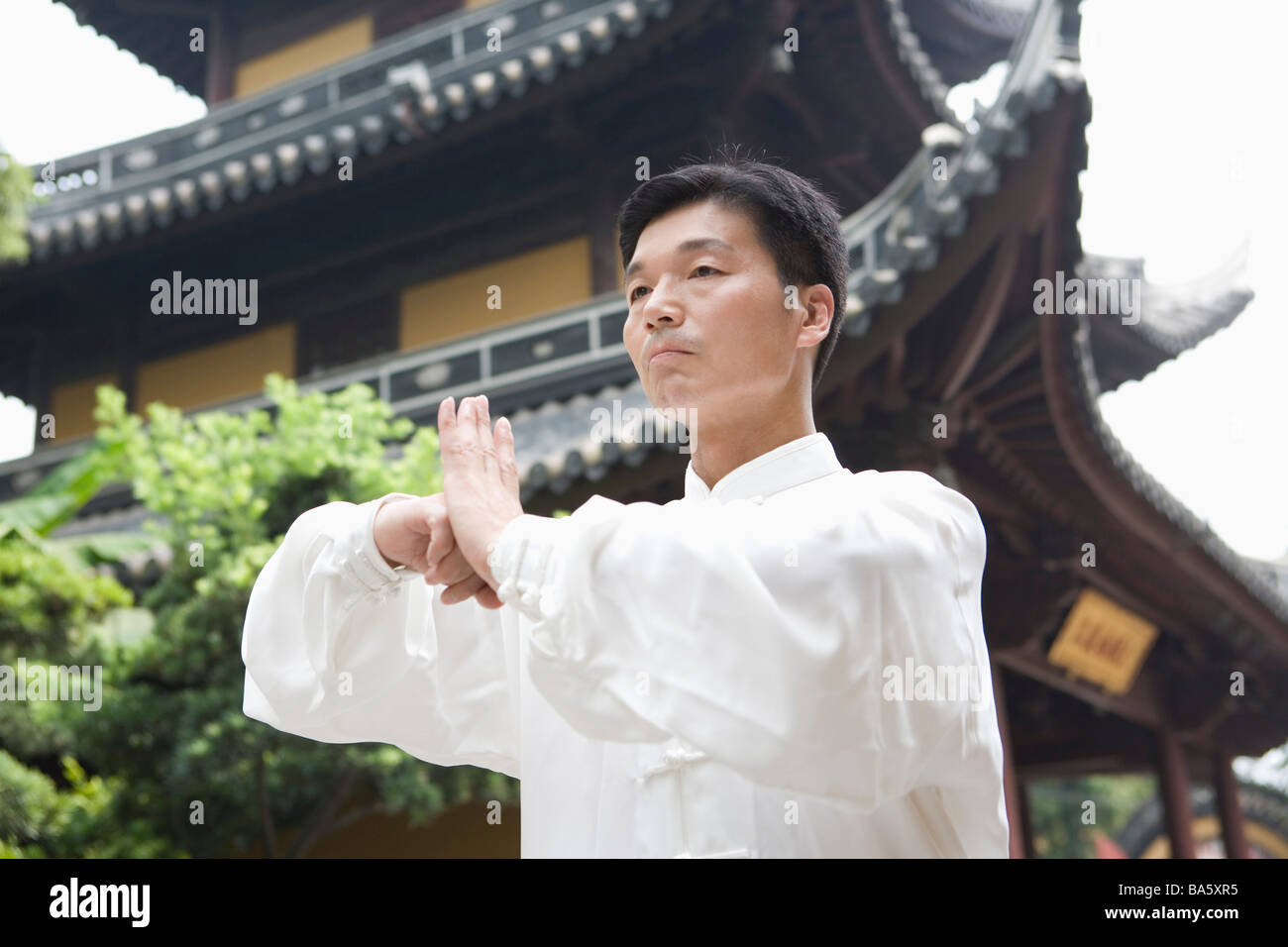 Man practicing Tai Chi in front of LongHua temple Stock Photo - Alamy