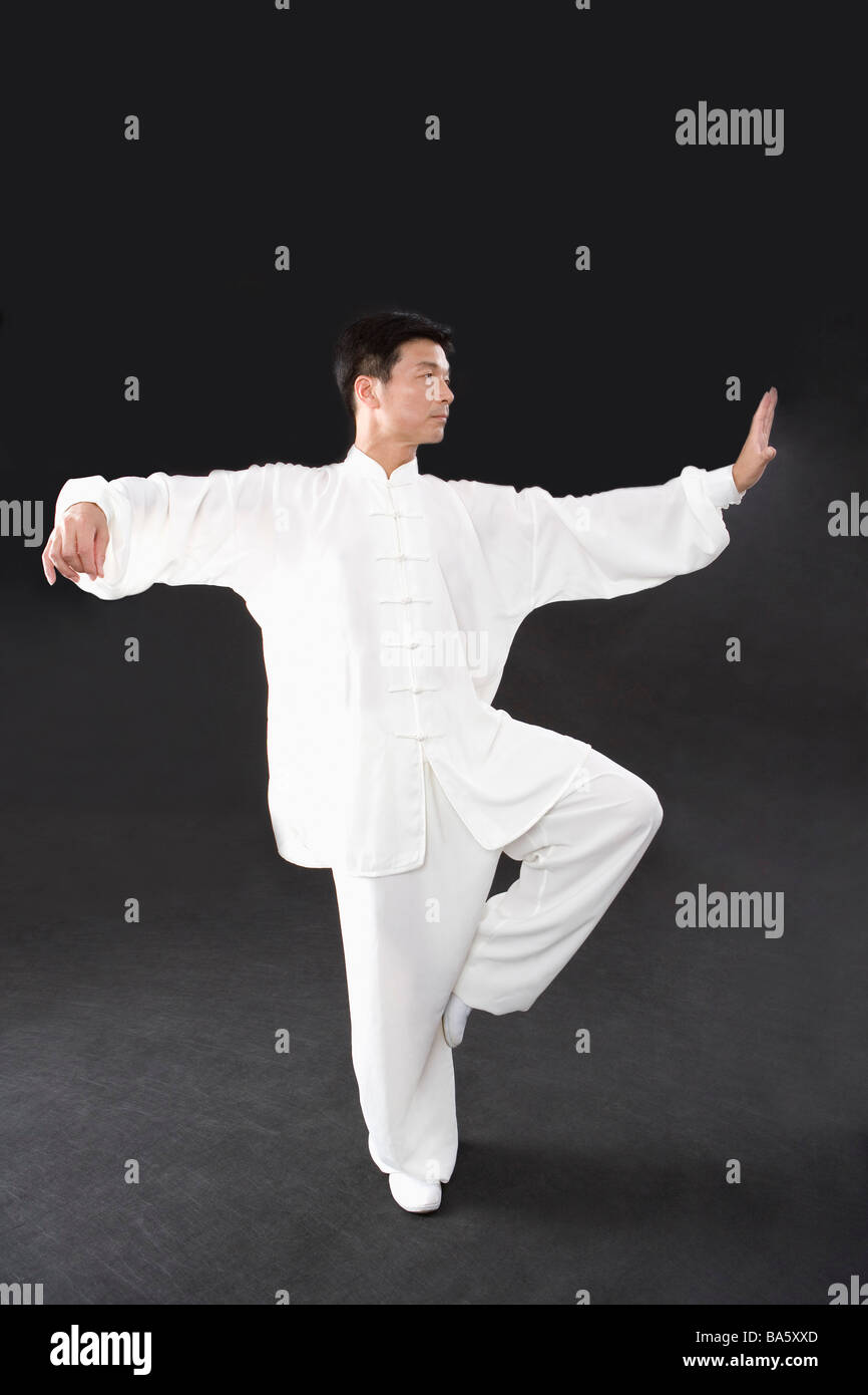 Man doing Tai Chi in studio shot Stock Photo - Alamy