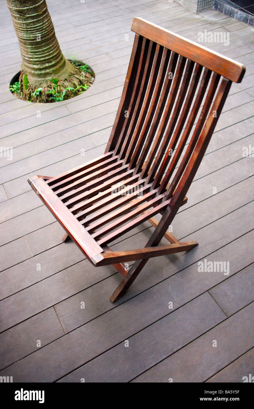 Folding chair outdoors Stock Photo - Alamy