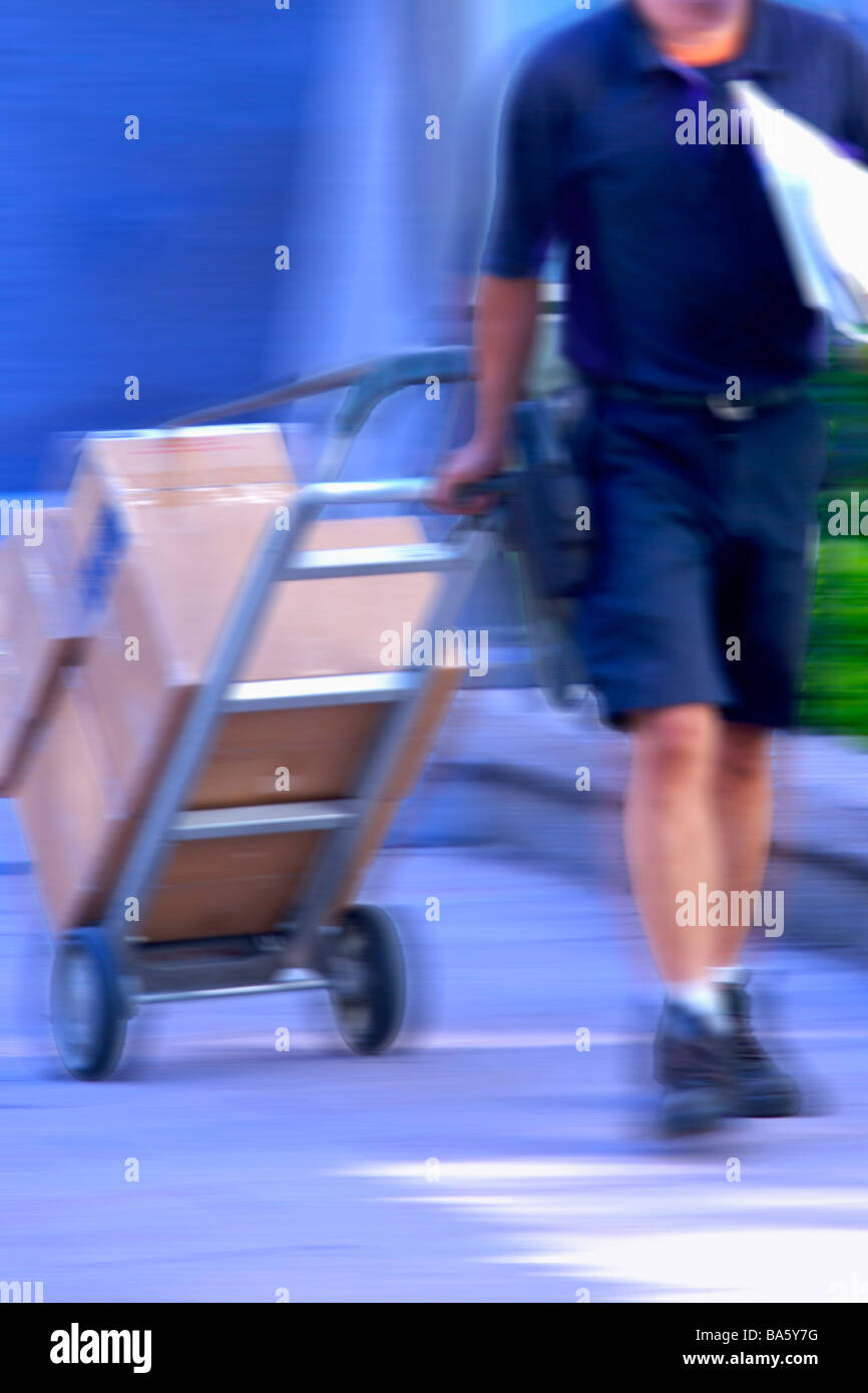 Man with Boxes on Hand Truck Stock Photo - Alamy