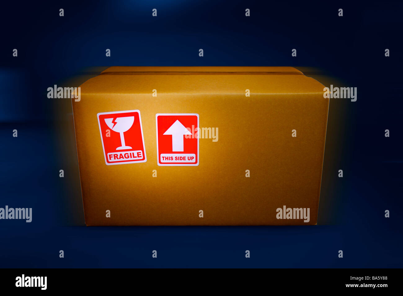 Cardboard box labeled fragile this side up Stock Photo - Alamy
