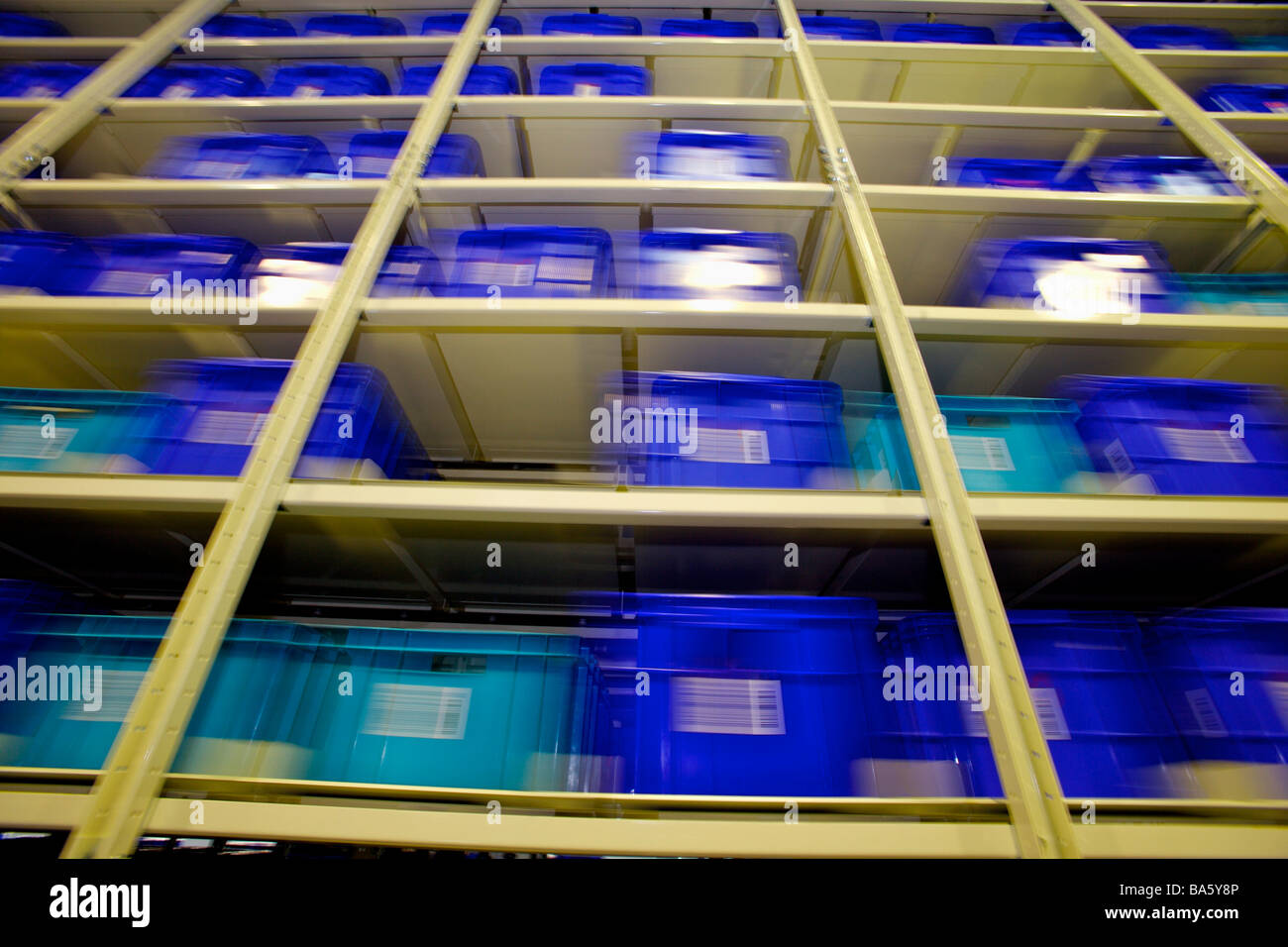 Boxes on shelves in warehouse Stock Photo - Alamy