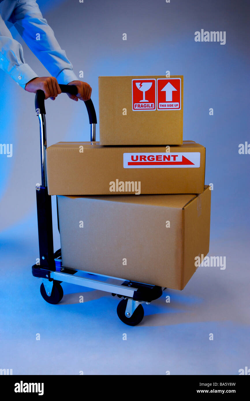 Man with Boxes on Hand Truck Stock Photo - Alamy
