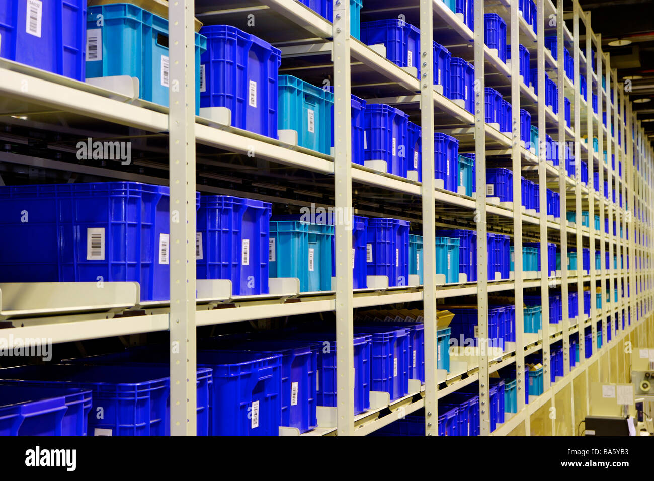 Plastic boxes on shelf Stock Photo - Alamy