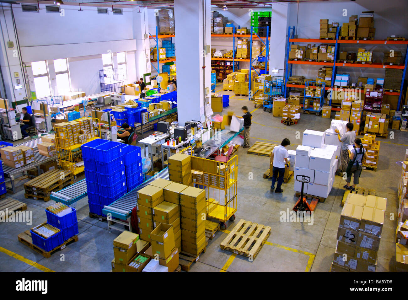 People working in warehouse Stock Photo - Alamy