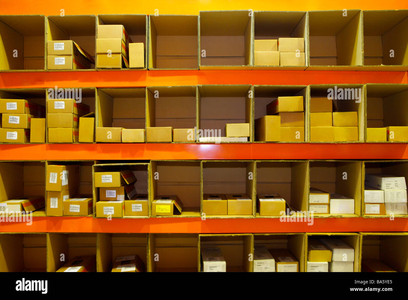 Warehouse shelves stacked with small boxes Stock Photo - Alamy