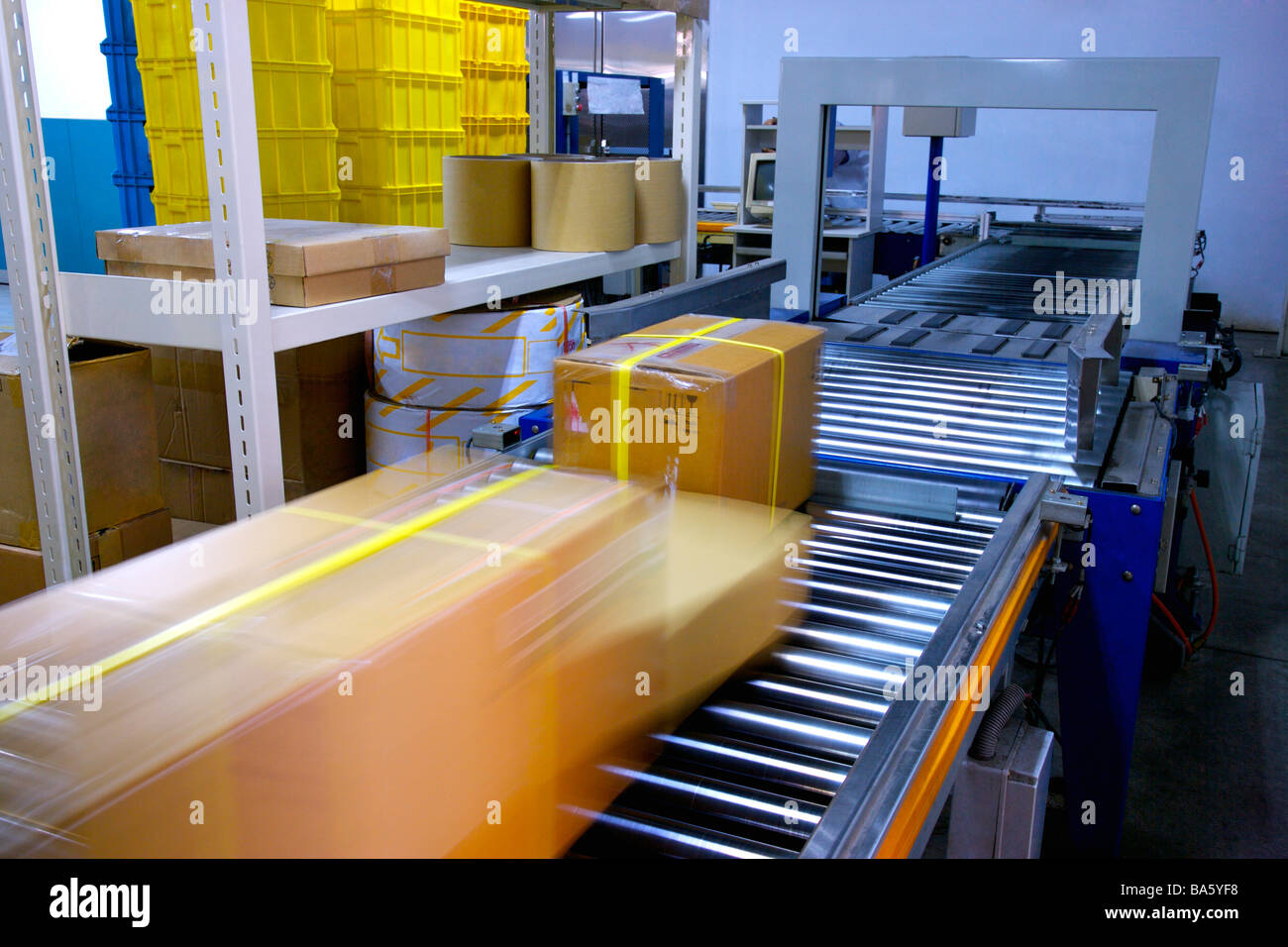 Boxes on conveyor belt Stock Photo - Alamy