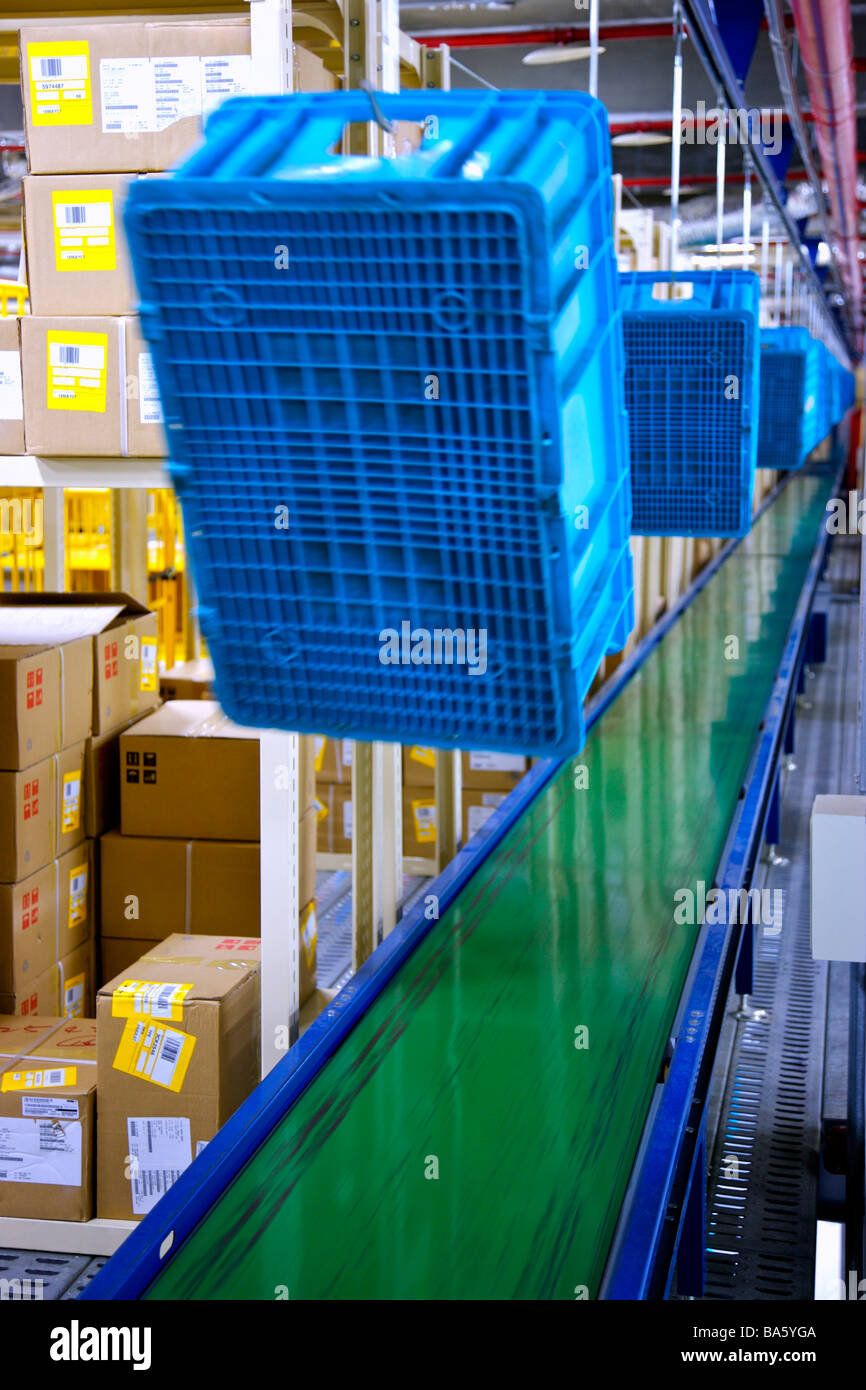 Warehouse with blue plastic boxes Stock Photo - Alamy