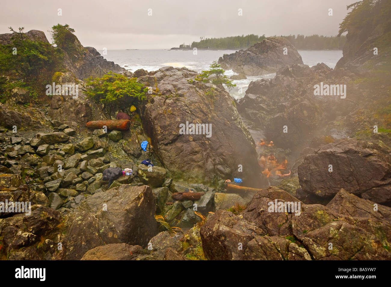 People bathing in the rocky pools of the geothermal hot springs at Hot ...