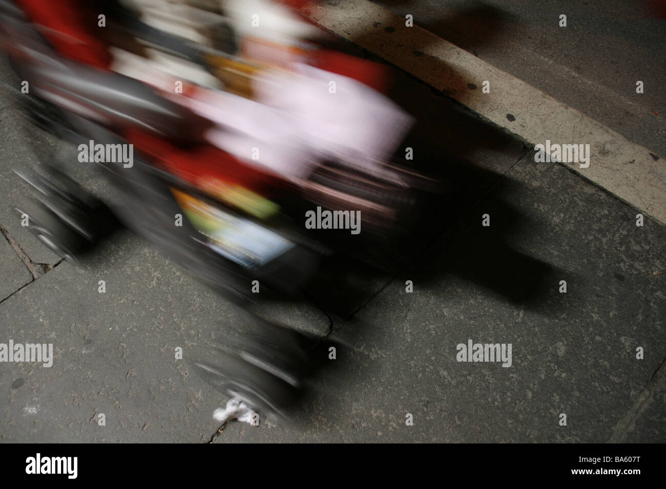Crowd city town wheel single mother man woman push pushing hi-res stock ...