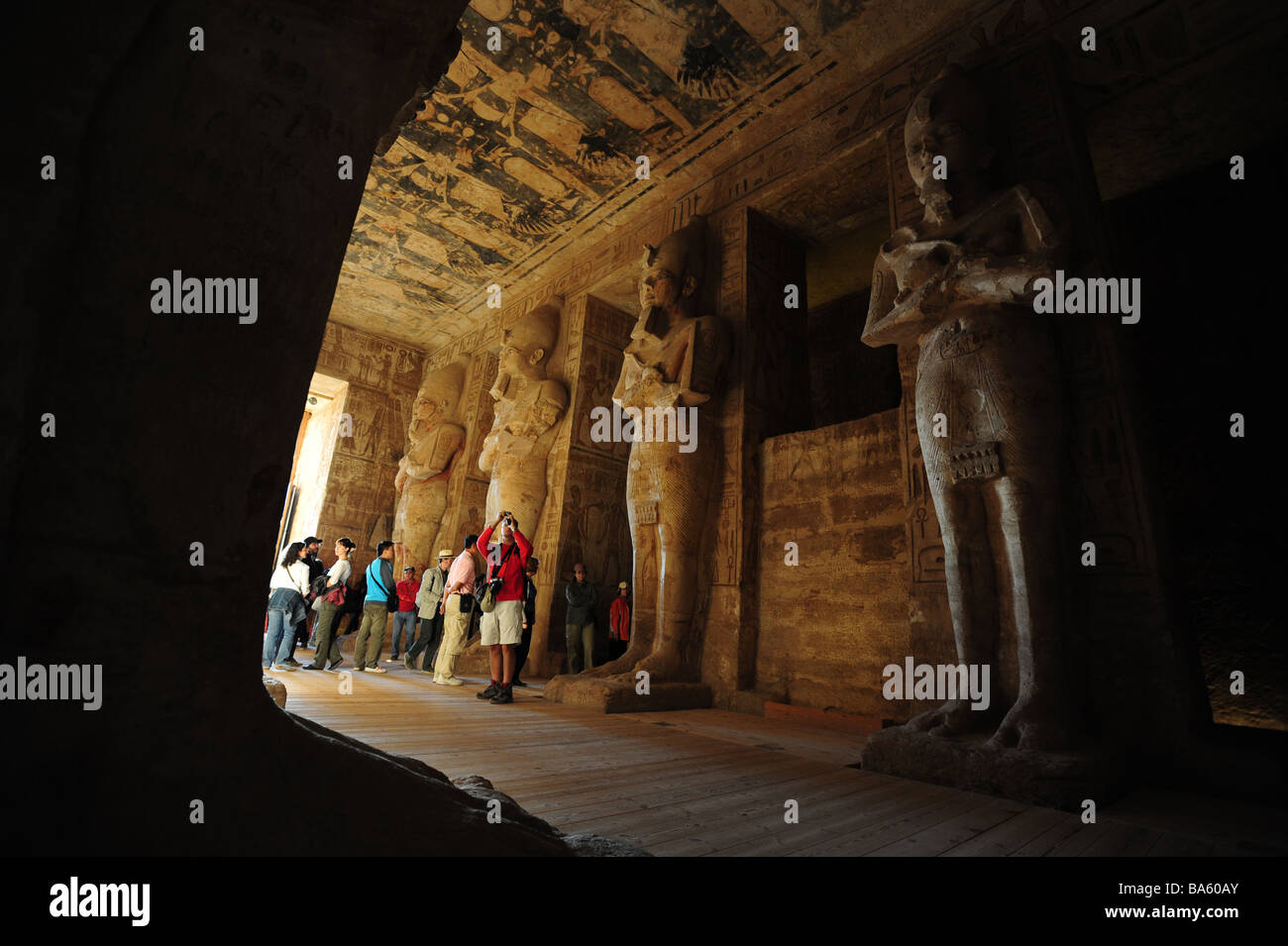 Egypt Abu Simbel temple of Ramses II tourists explore the interior of ...
