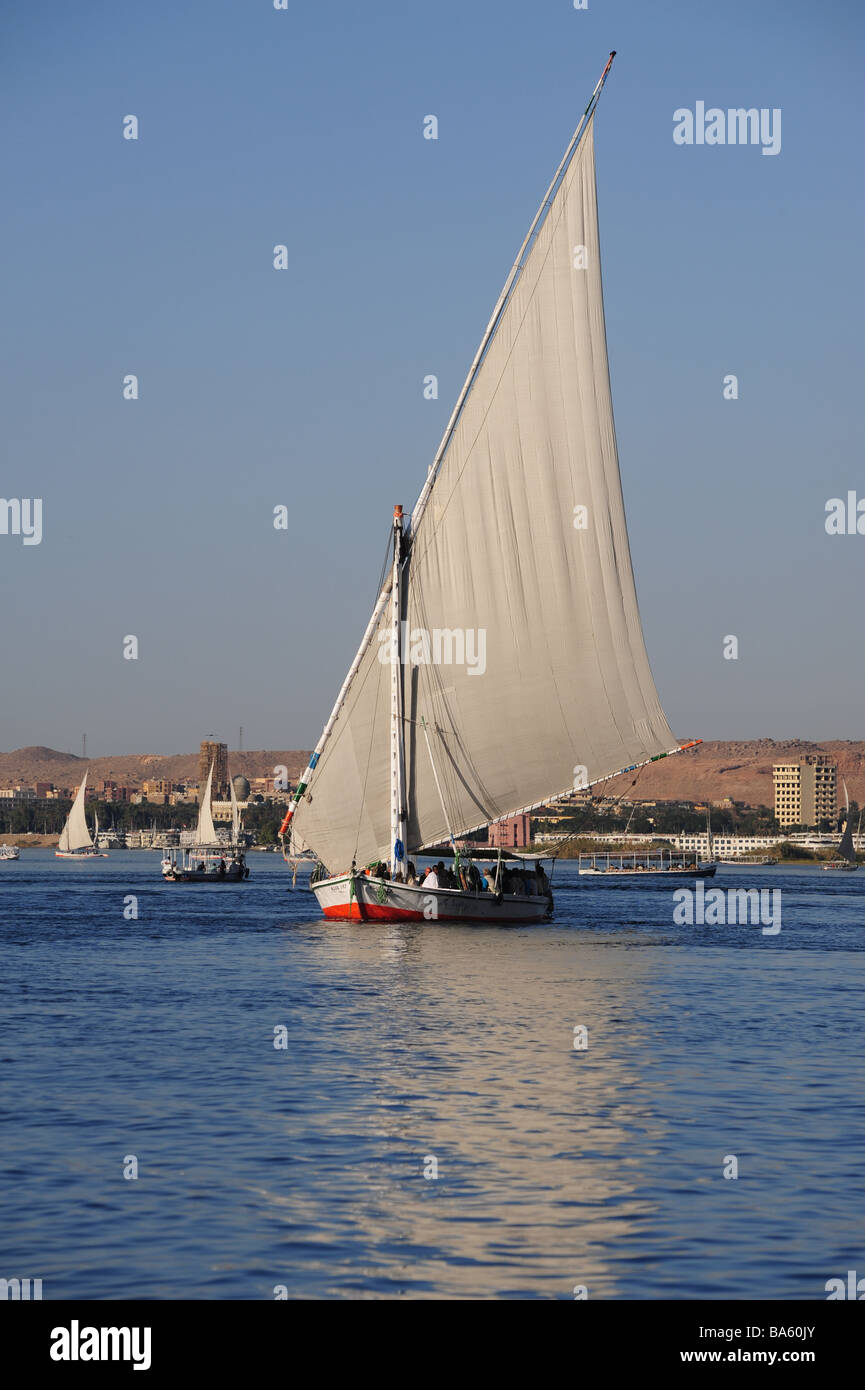 Egypt Aswan felucca boats ply the Nile River Stock Photo - Alamy