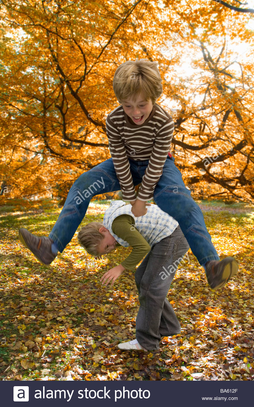 Child Bending Over Boy Stock Photos & Child Bending Over Boy Stock ...
