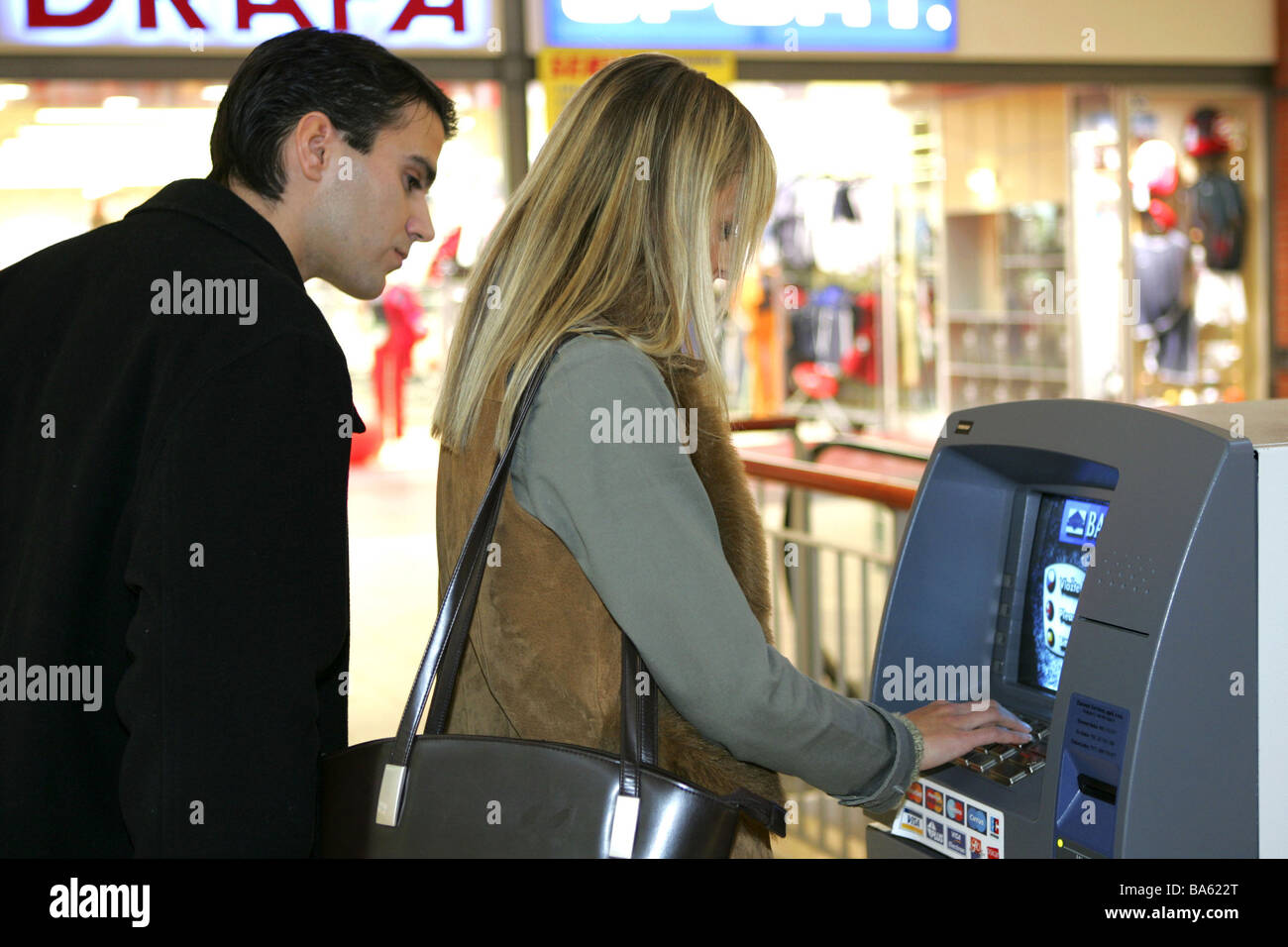 Woman young automatic teller hi-res stock photography and images - Alamy
