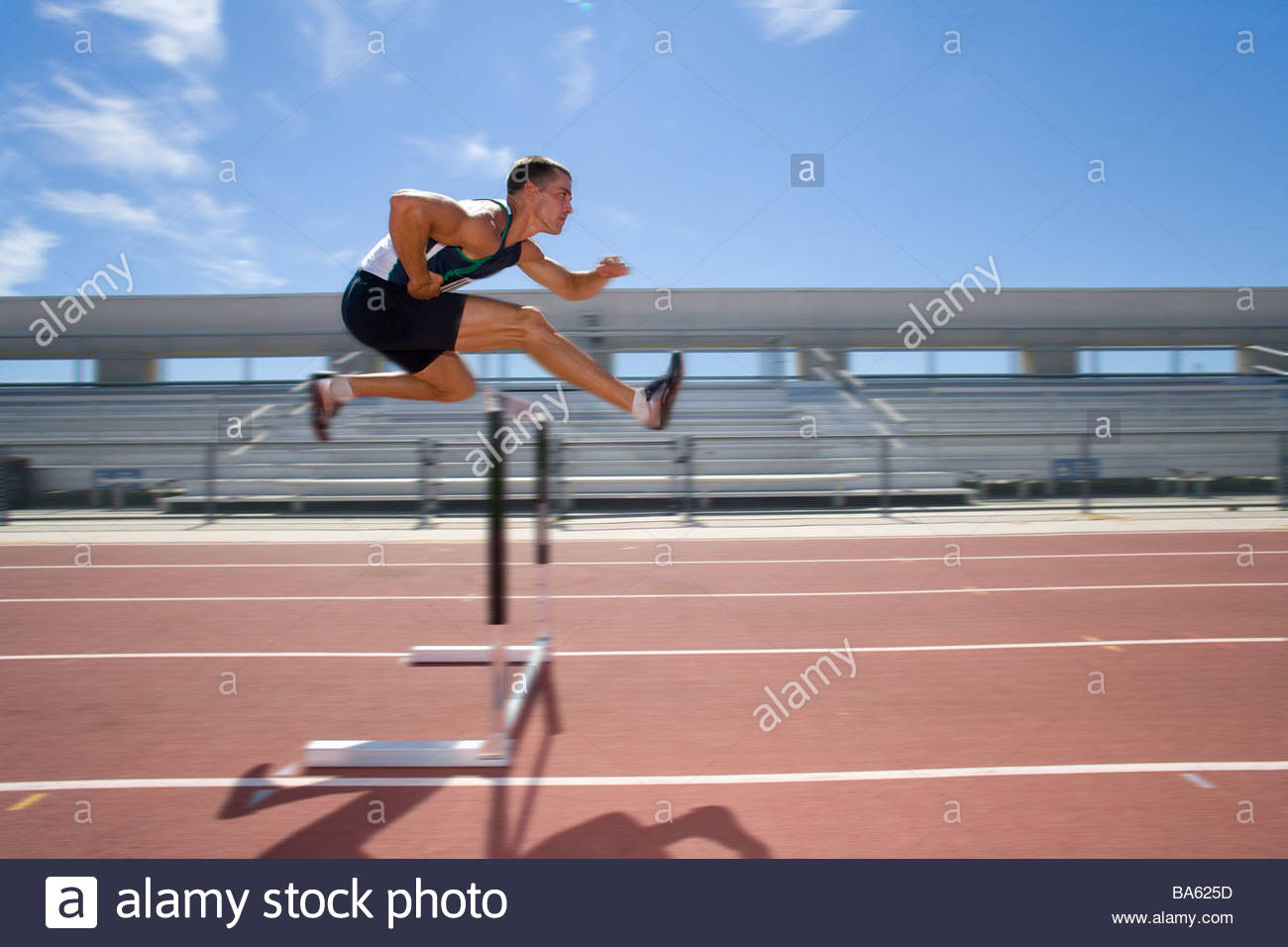Male athlete jumping over jump (blurred motion Stock Photo: 23490361 ...