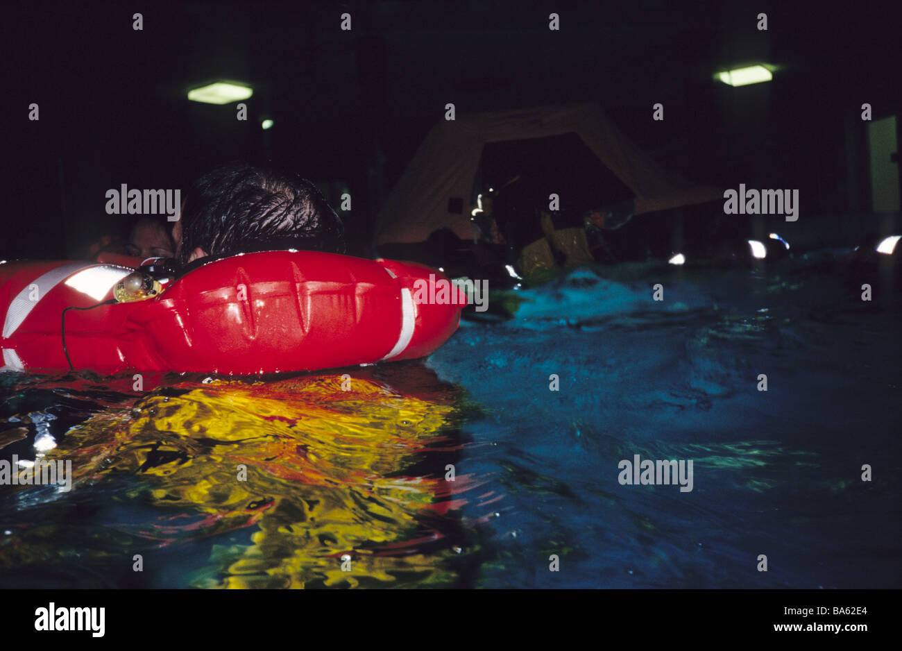 Swimming pool rescue-practice person swim vest detail water night ...