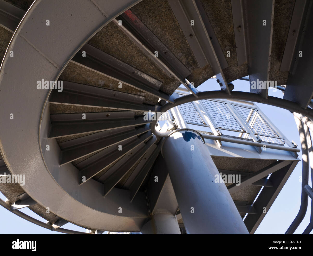 Looking from below a steel spiral staircase Stock Photo - Alamy