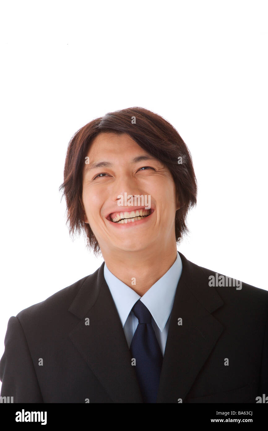 Portrait of businessman laughing looking up Stock Photo - Alamy