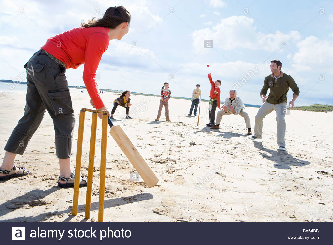Family Playing Cricket On Beach Stock Photos & Family Playing Cricket ...