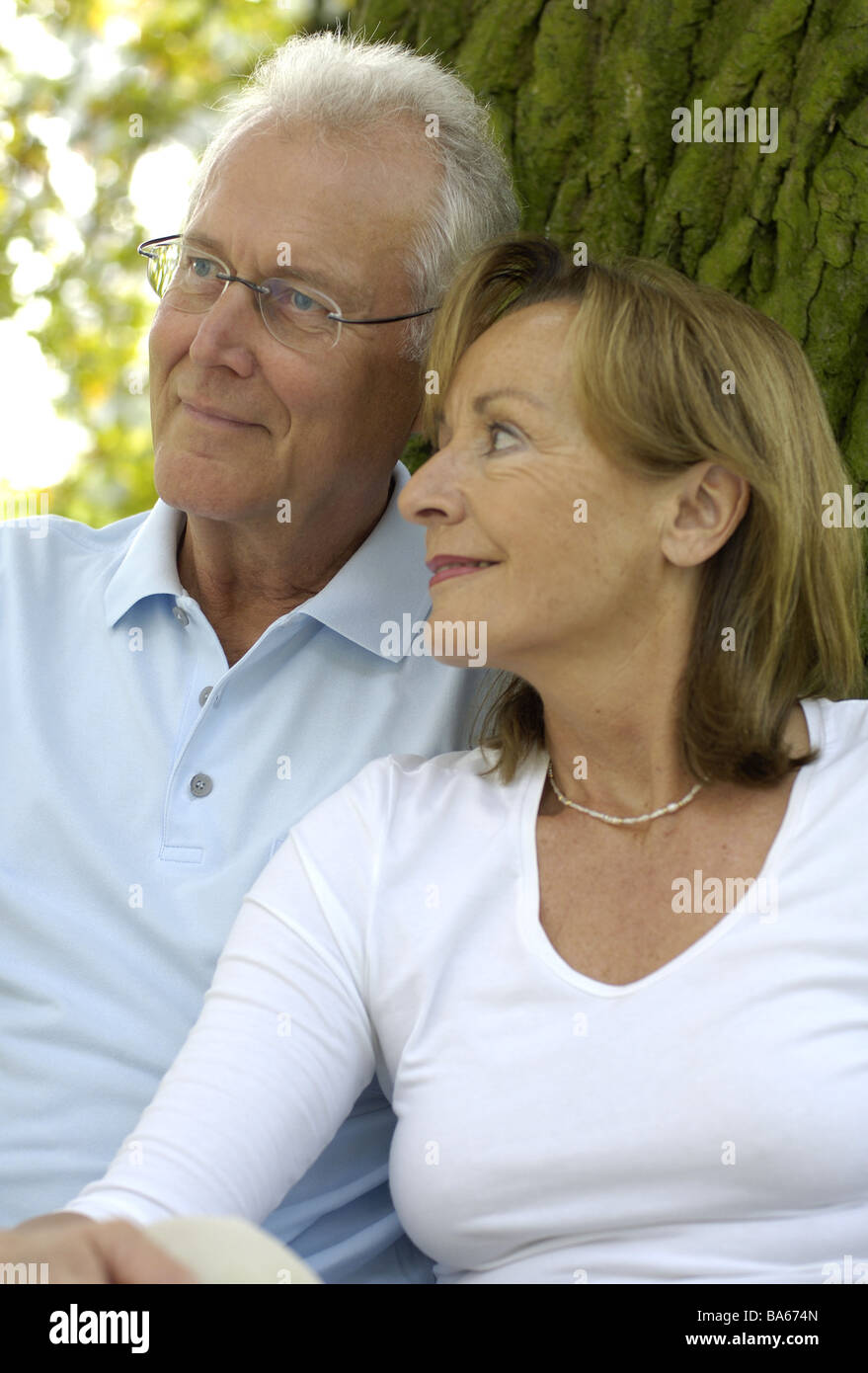 Sits garden senior-pair tree leans cheerfully semi-portrait series ...