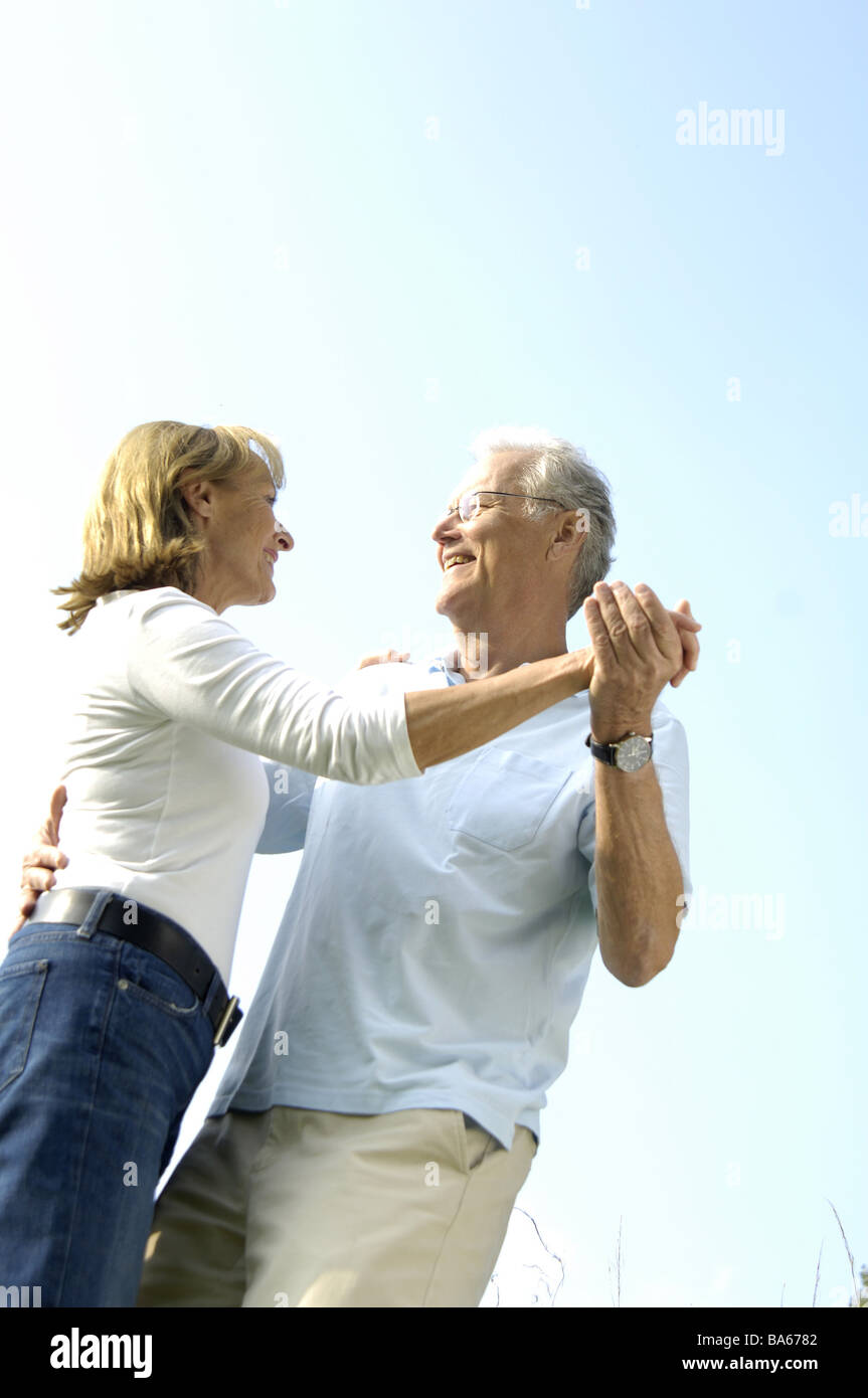 Senior-pair laughs dances detail from below series people 50-60 years ...