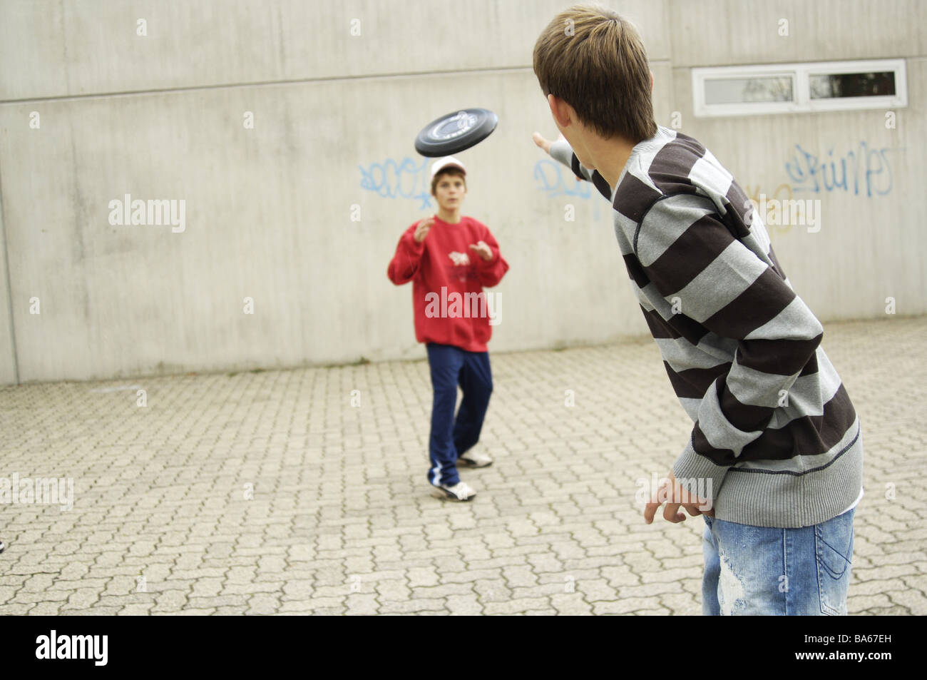 Teenagers boys plays people two Frisbee series youth teenagers 12-14 ...