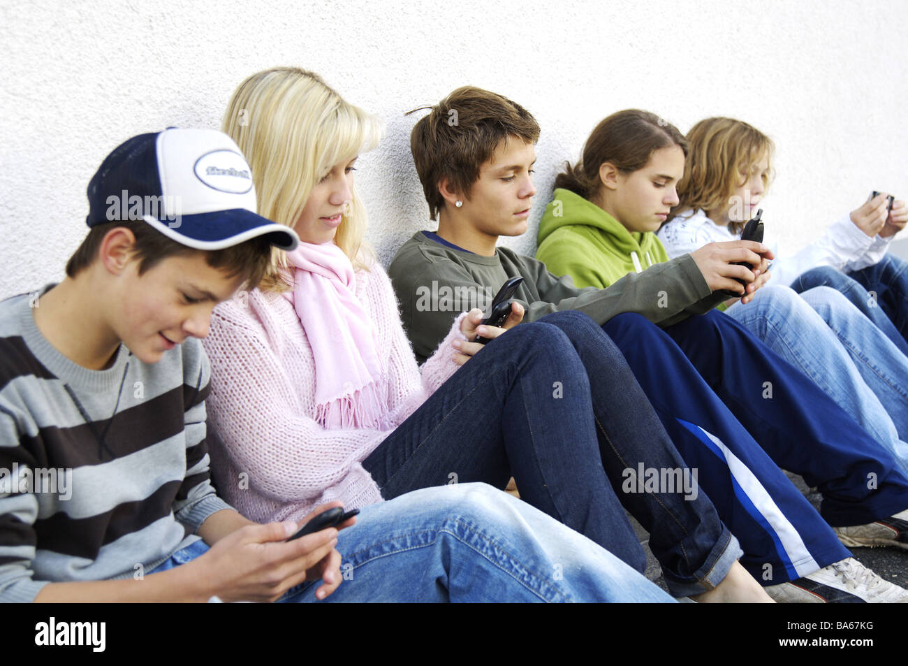 Teenagers clique sit activity cell phones group-picture series people ...