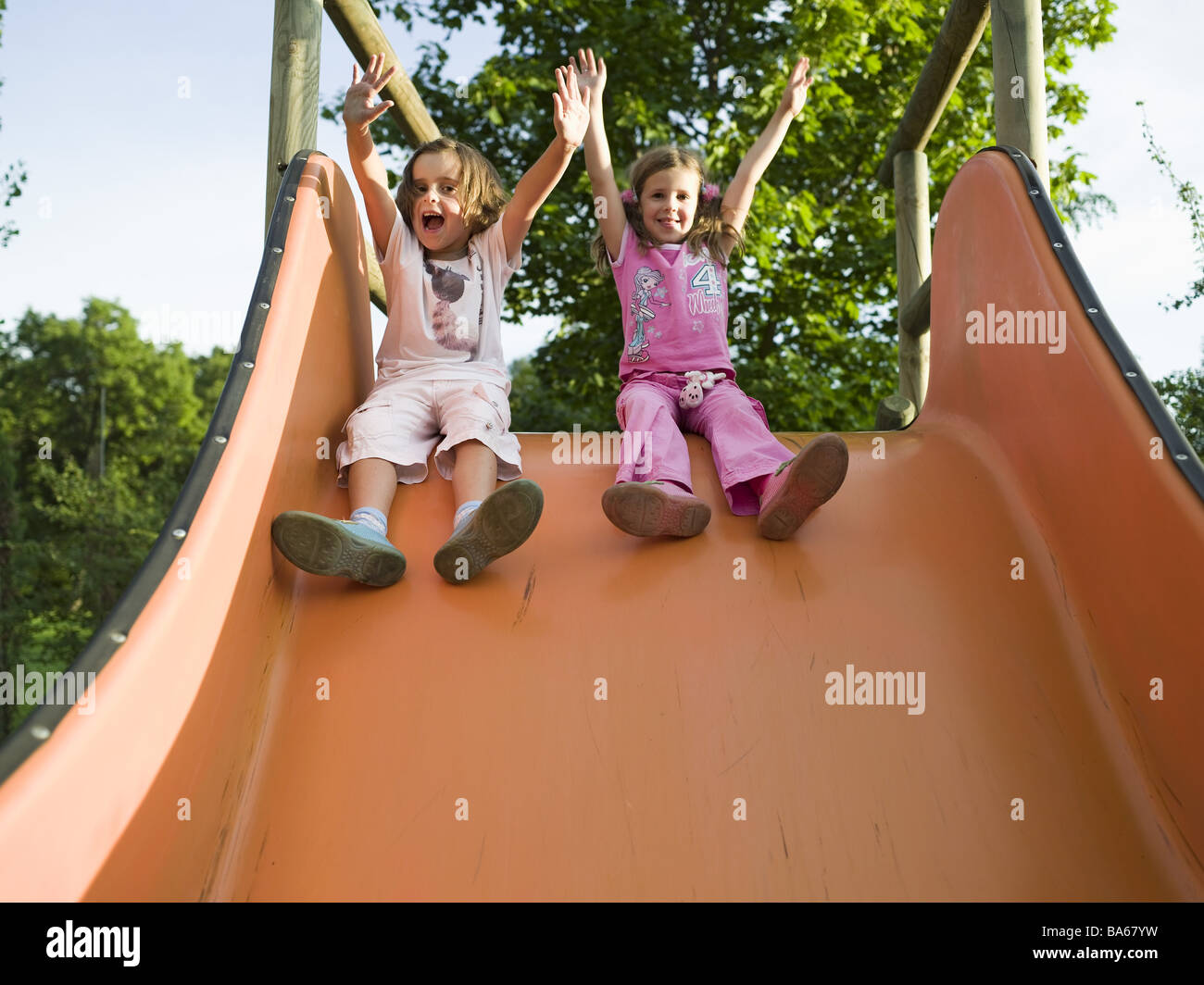 Playground girls two slide plays cheerfully series people slides ...