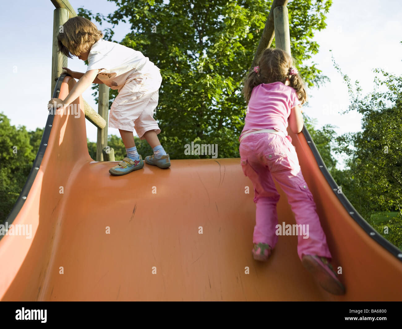 Playground girls two slide plays cheerfully series people children ...