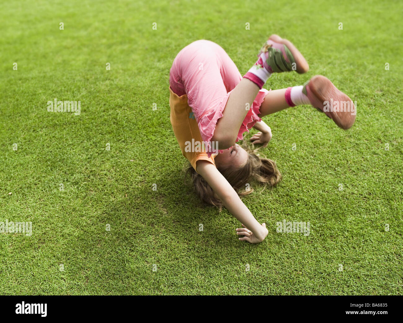 Meadow girls somersault movement series people child 6 years garden ...