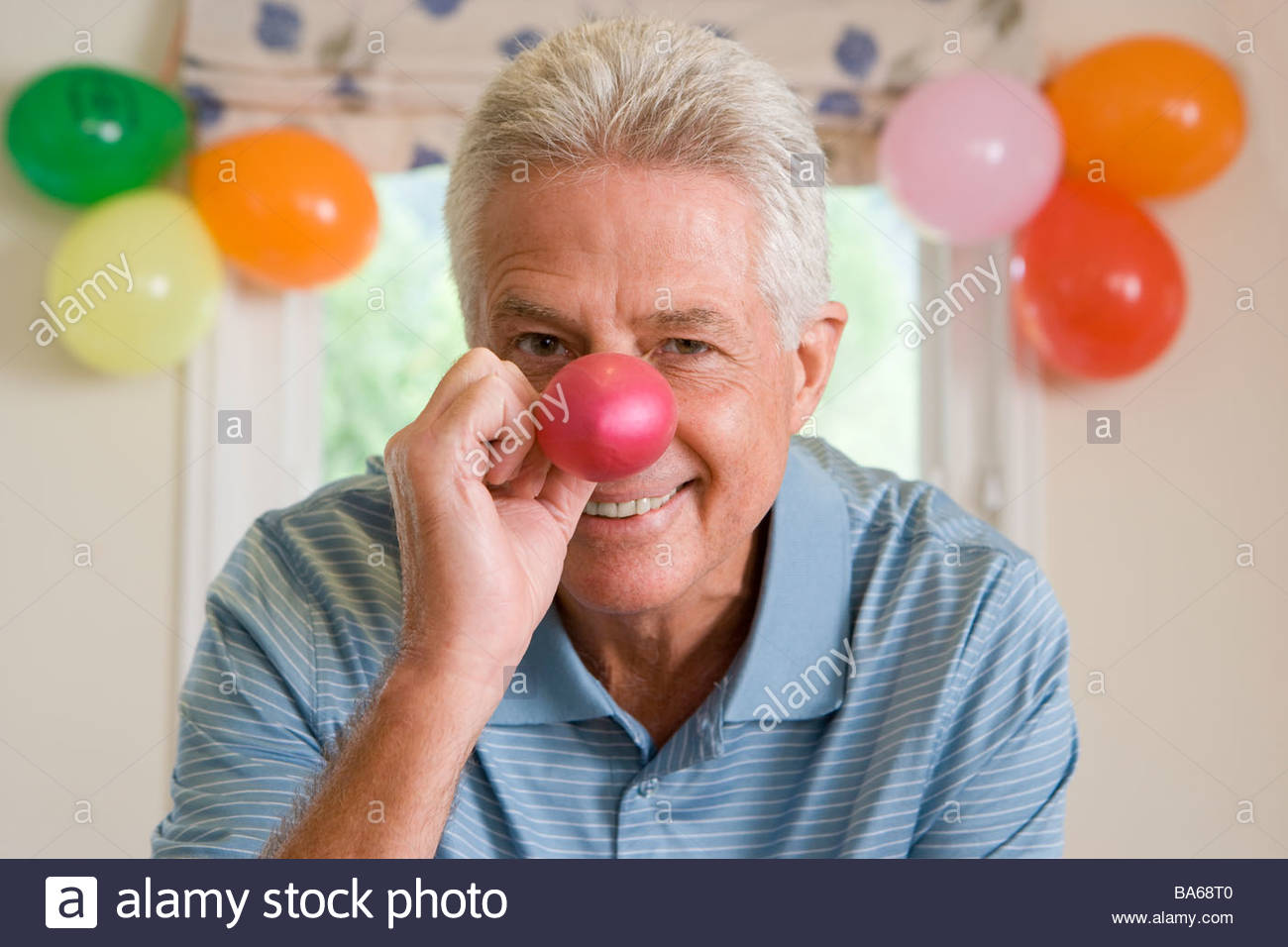 Man Blowing Up Balloons Stock Photos & Man Blowing Up Balloons Stock ...