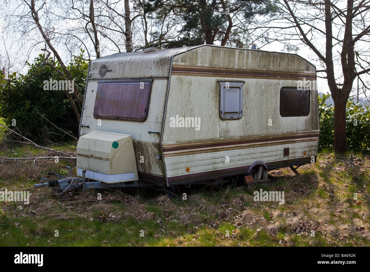 Derelict caravan parked in field Stock Photo - Alamy