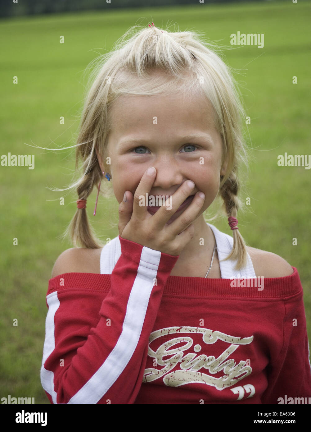 Girls cheerfully smile people reproach mouth hand portrait child ...