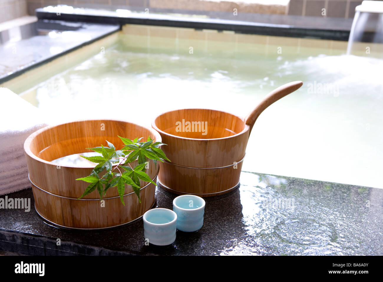 Bucket ladle and cups by pool Stock Photo - Alamy