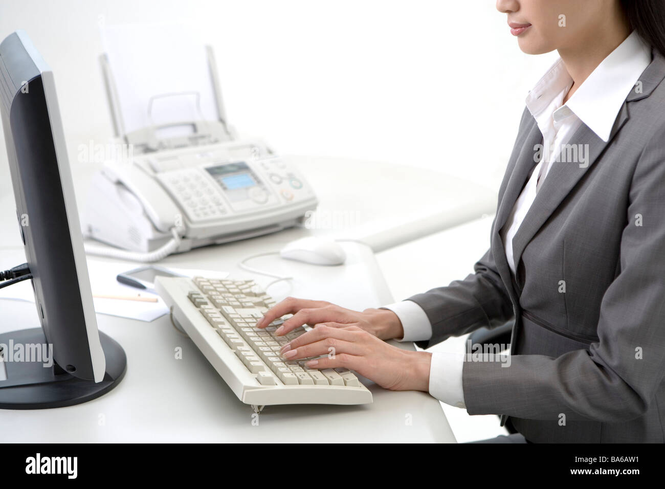 Close up of businesswoman using computer side view Stock Photo - Alamy