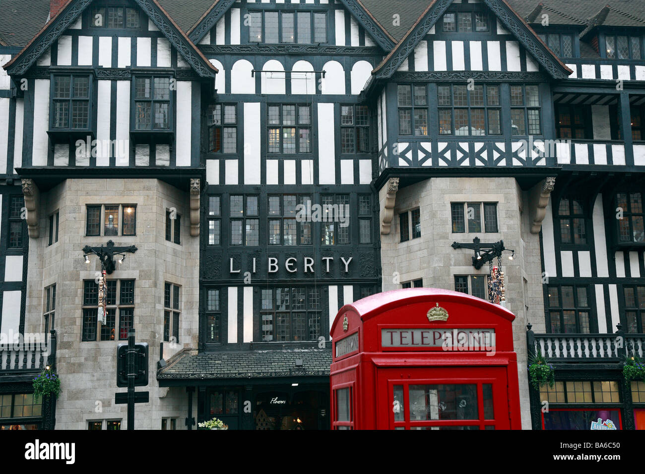 Red Telephone box in front of Liberty department store mock tudor ...