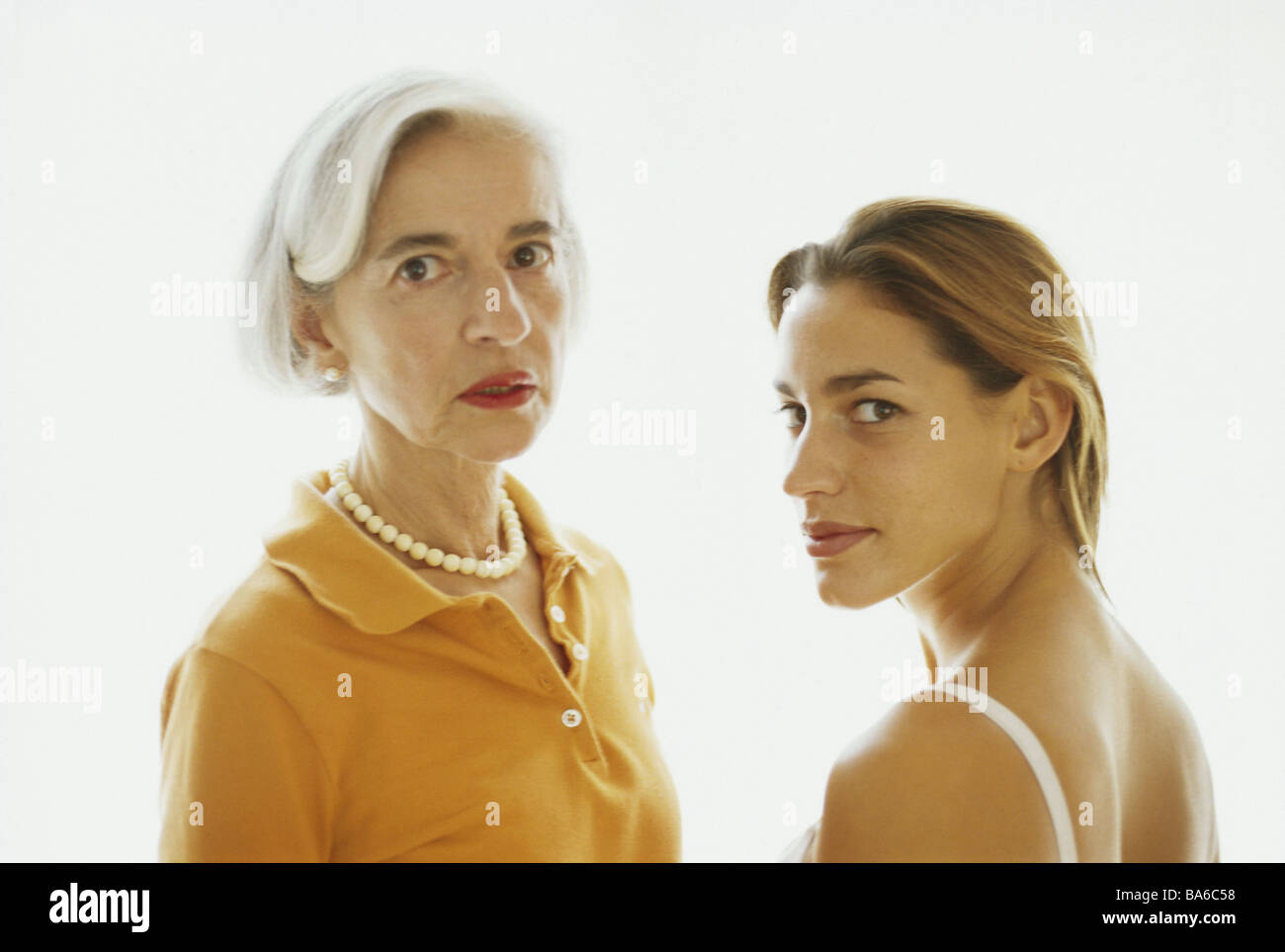 Mother daughter seriously shoulder-gaze portrait series people women 30 ... Mother daughter seriously shoulder-gaze portrait series people women 30 ...