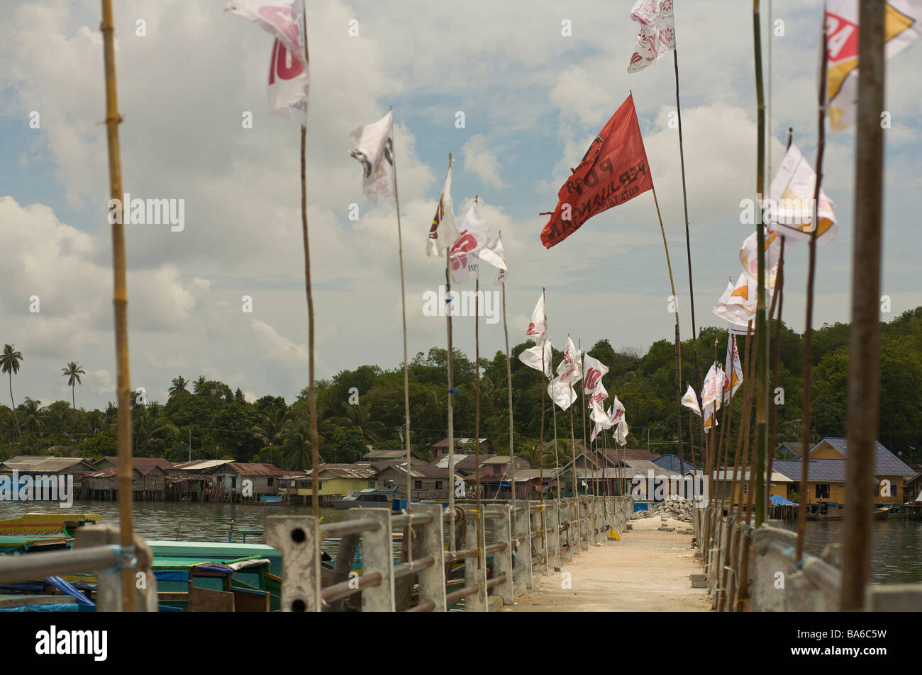 Flags on pier Stock Photo - Alamy