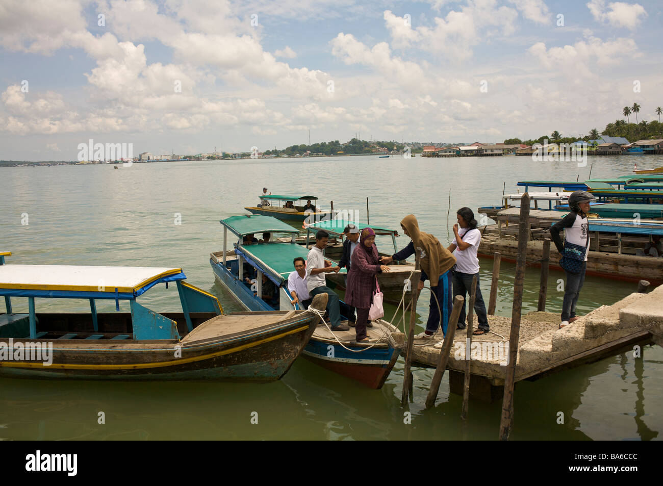 Taxi boat offloading passengers Stock Photo - Alamy