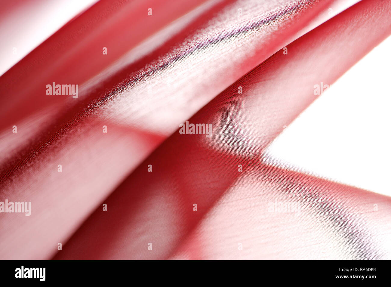 Sheer red fabric Stock Photo - Alamy