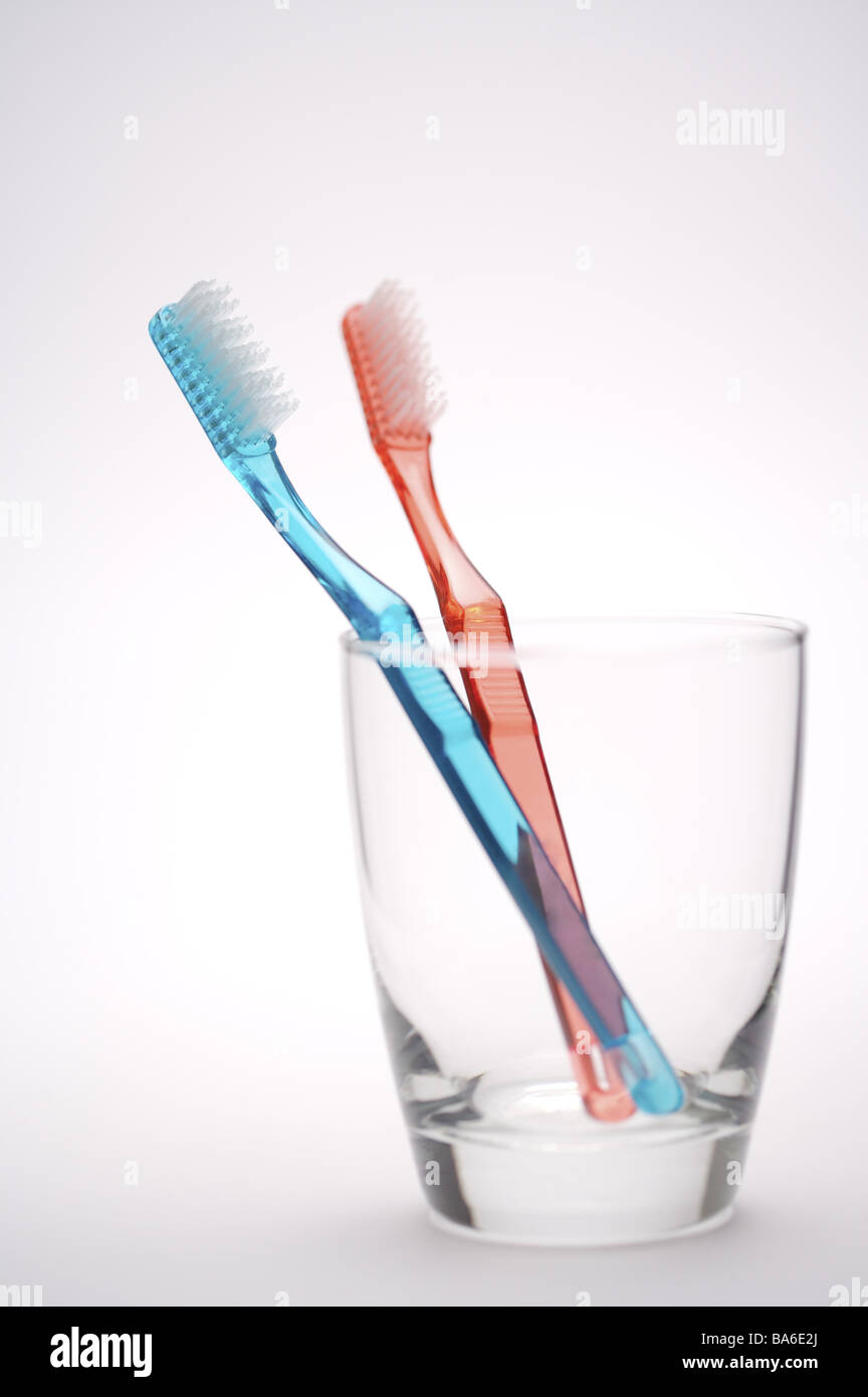 Toothbrushes in glass Stock Photo - Alamy