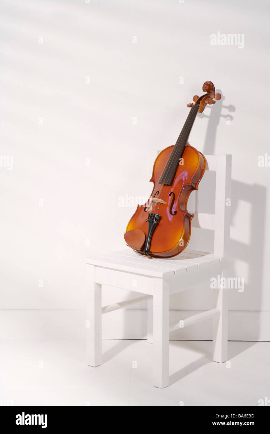 Violin on chair elevated view Stock Photo - Alamy